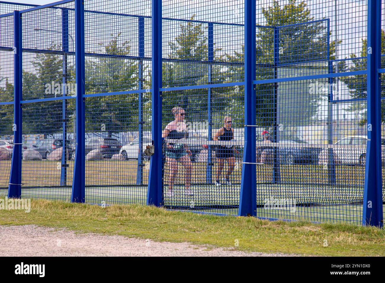 People playing padel in Pyhän Birgitan puisto Padel Center outdoor ...