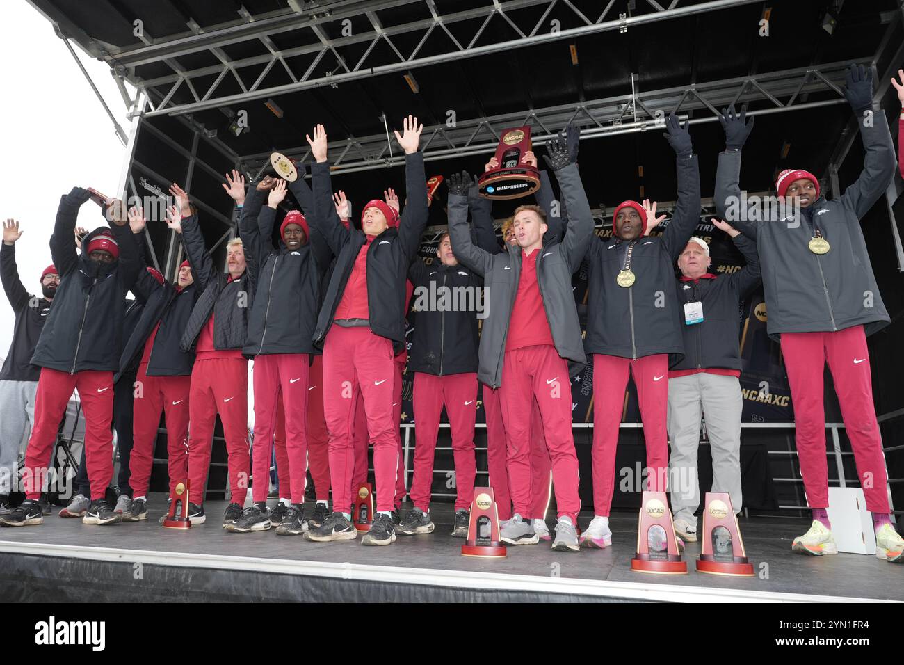 The Arkansas Razorbacks men's team including coach Chris Bucknam ...