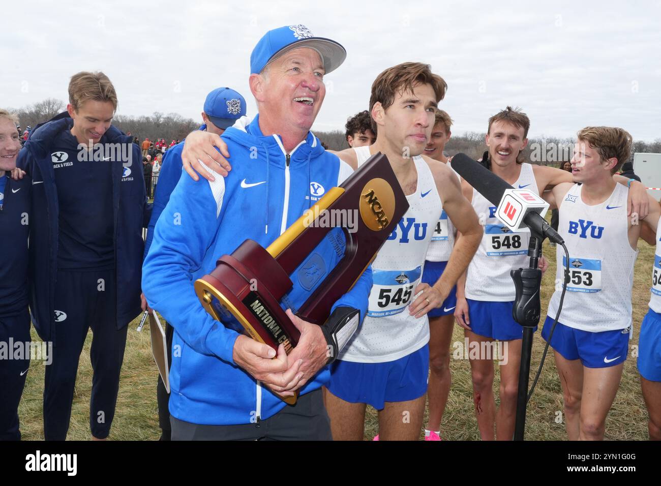 Members of the BYU coach Ed Eyestone and Casey Clinger celebrate after ...