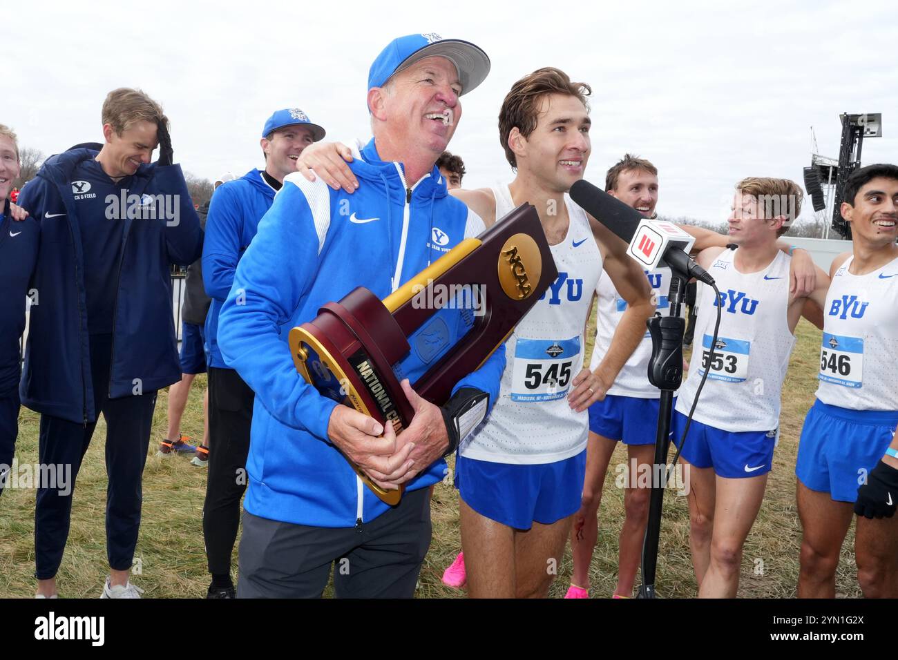 Members of the BYU coach Ed Eyestone and Casey Clinger celebrate after ...