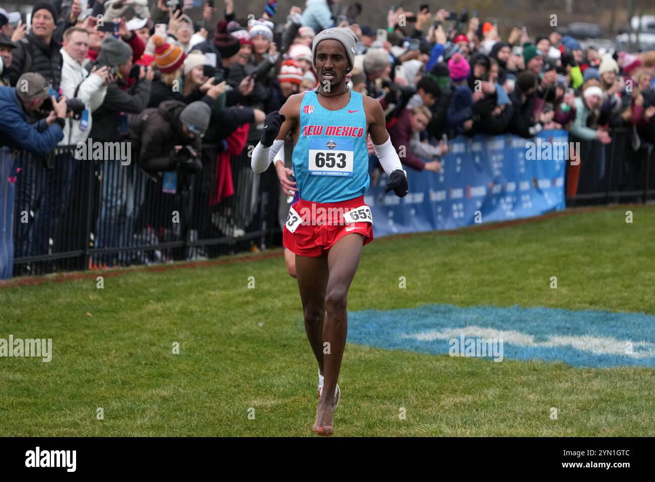 Habtom Samuel of New Mexico places second with one shoe in 28:38.9 ...
