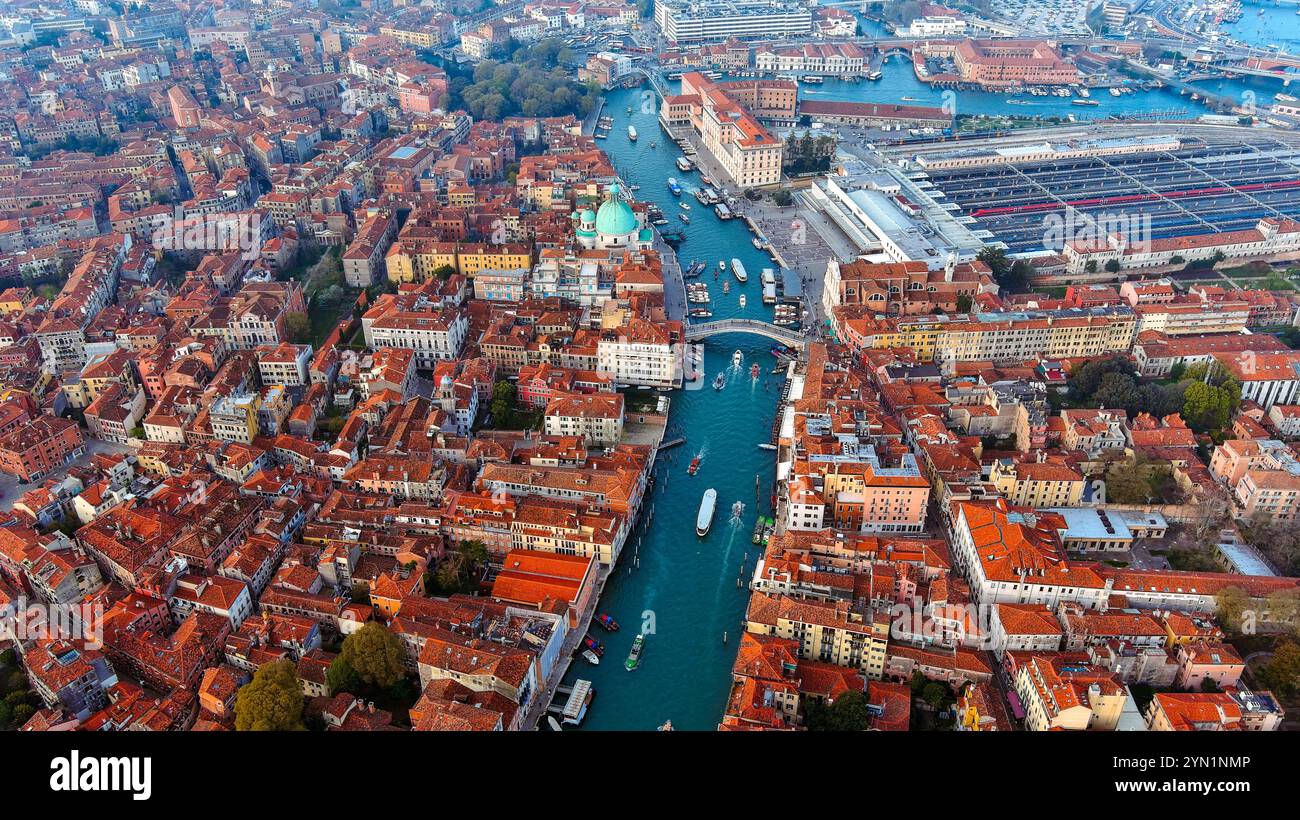 A scenic aerial view of Venice’s historic rooftops and canals with the ...