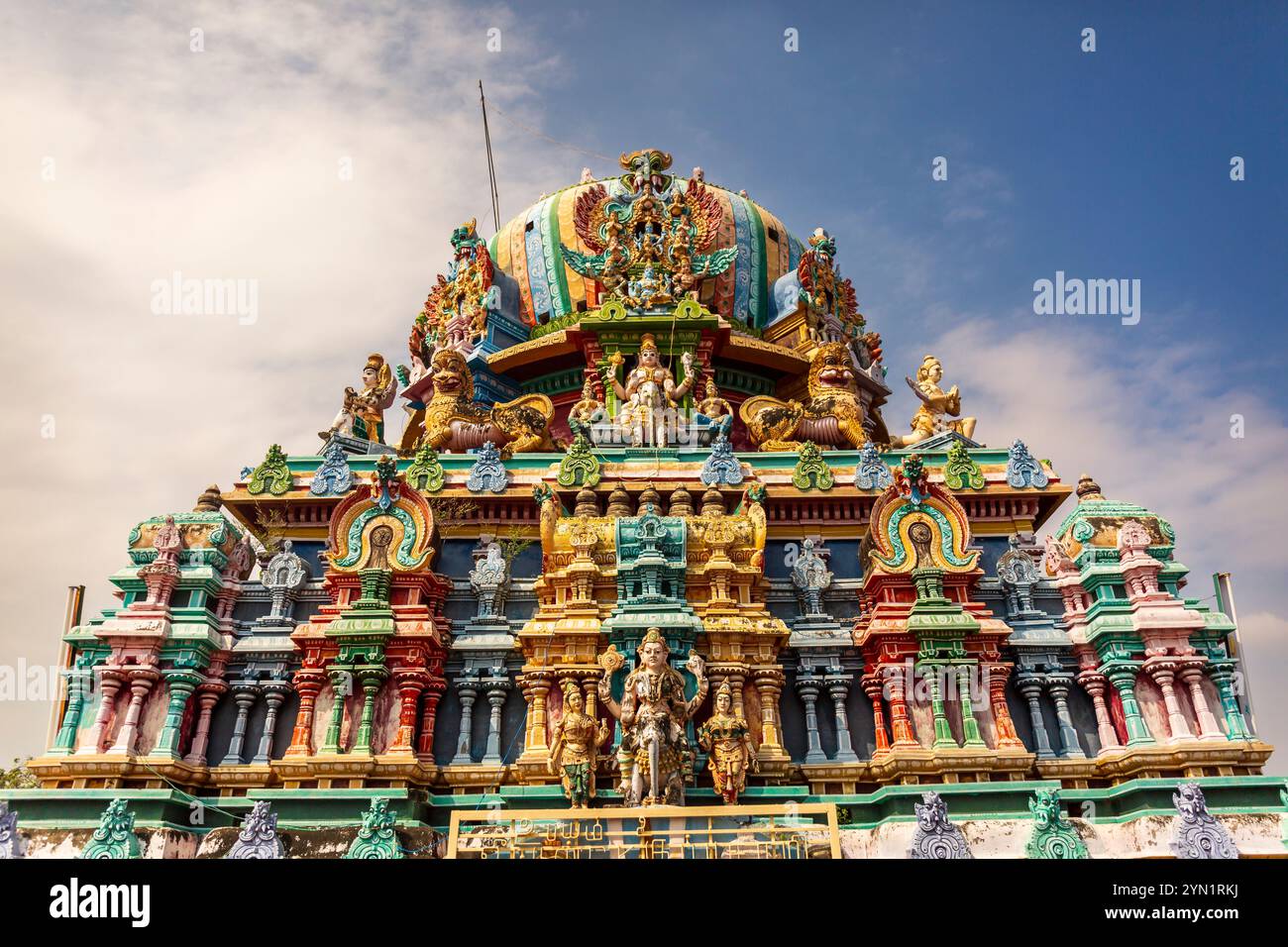 A vividly colorful gopuram of a South Indian temple showcasing ...