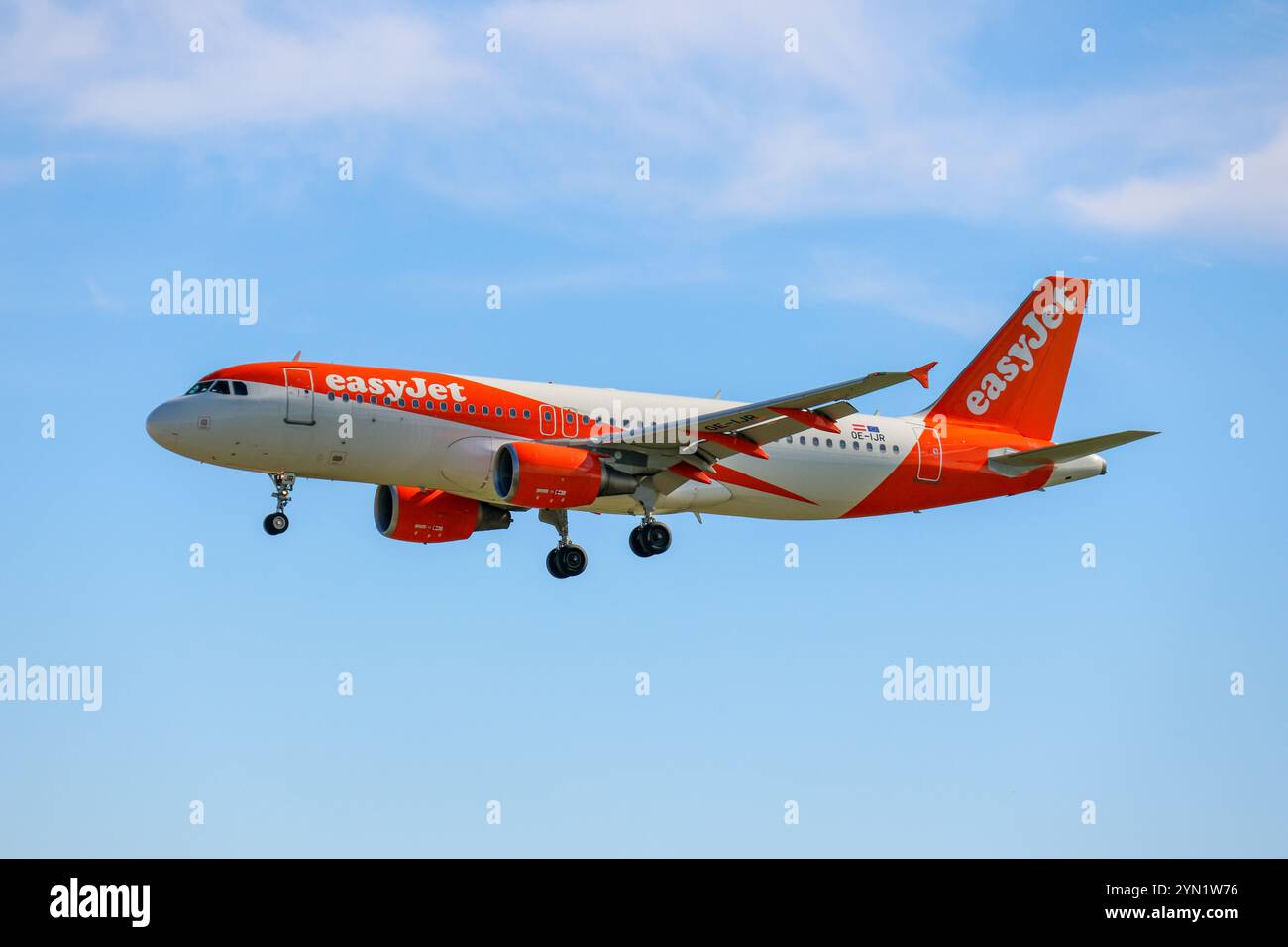 Orange and white easyjet airbus a320 landing at lisbon humberto delgado ...