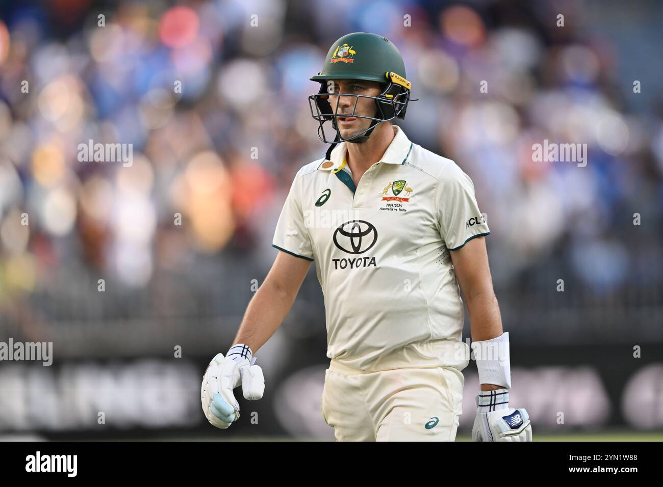 Perth, Australia. 24th Nov, 2024. Pat Cummins of Australia walks from ...