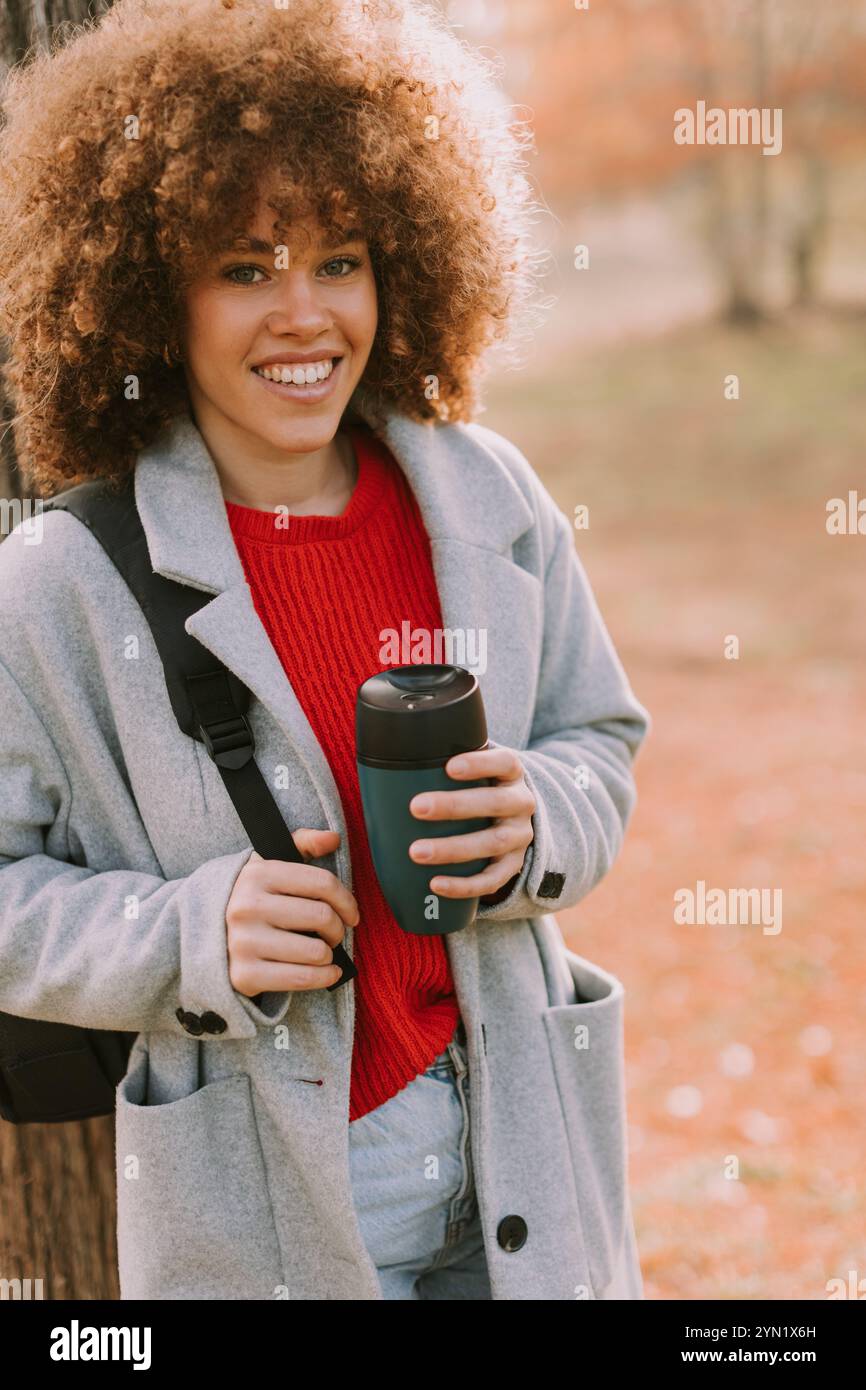 Woman in orange coat enjoys hi-res stock photography and images - Alamy