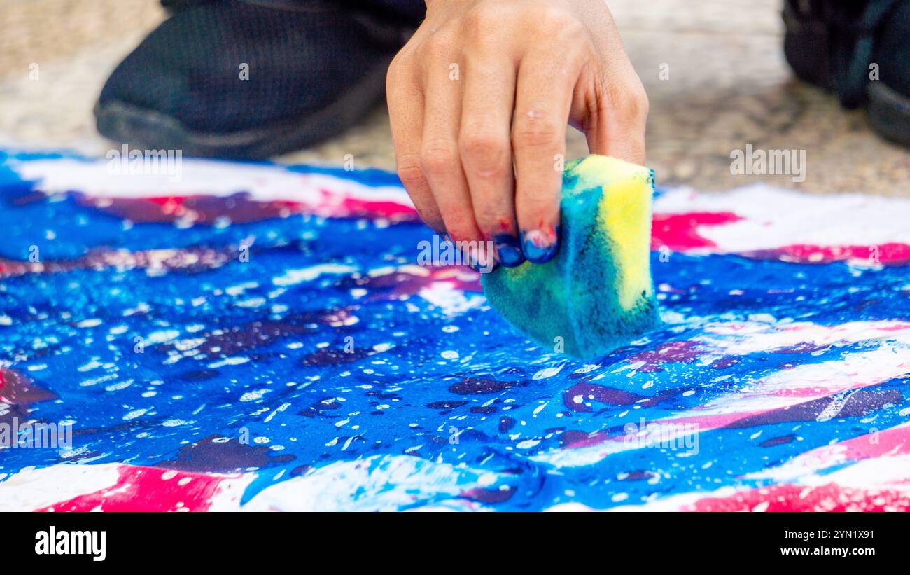 Making splash batik (batik ciprat). Batik is a type of cloth motif ...