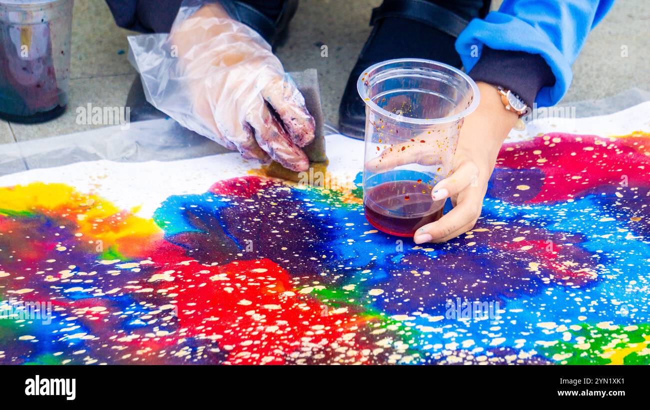 Making splash batik (batik ciprat). Batik is a type of cloth motif ...
