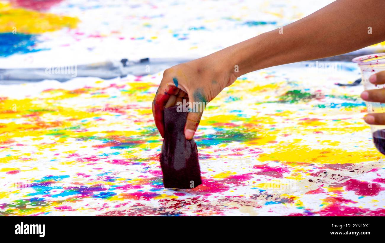 Making splash batik (batik ciprat). Batik is a type of cloth motif ...
