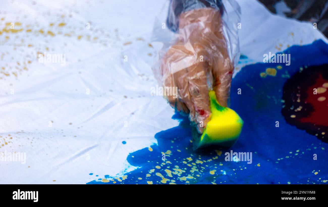 Making splash batik (batik ciprat). Batik is a type of cloth motif ...
