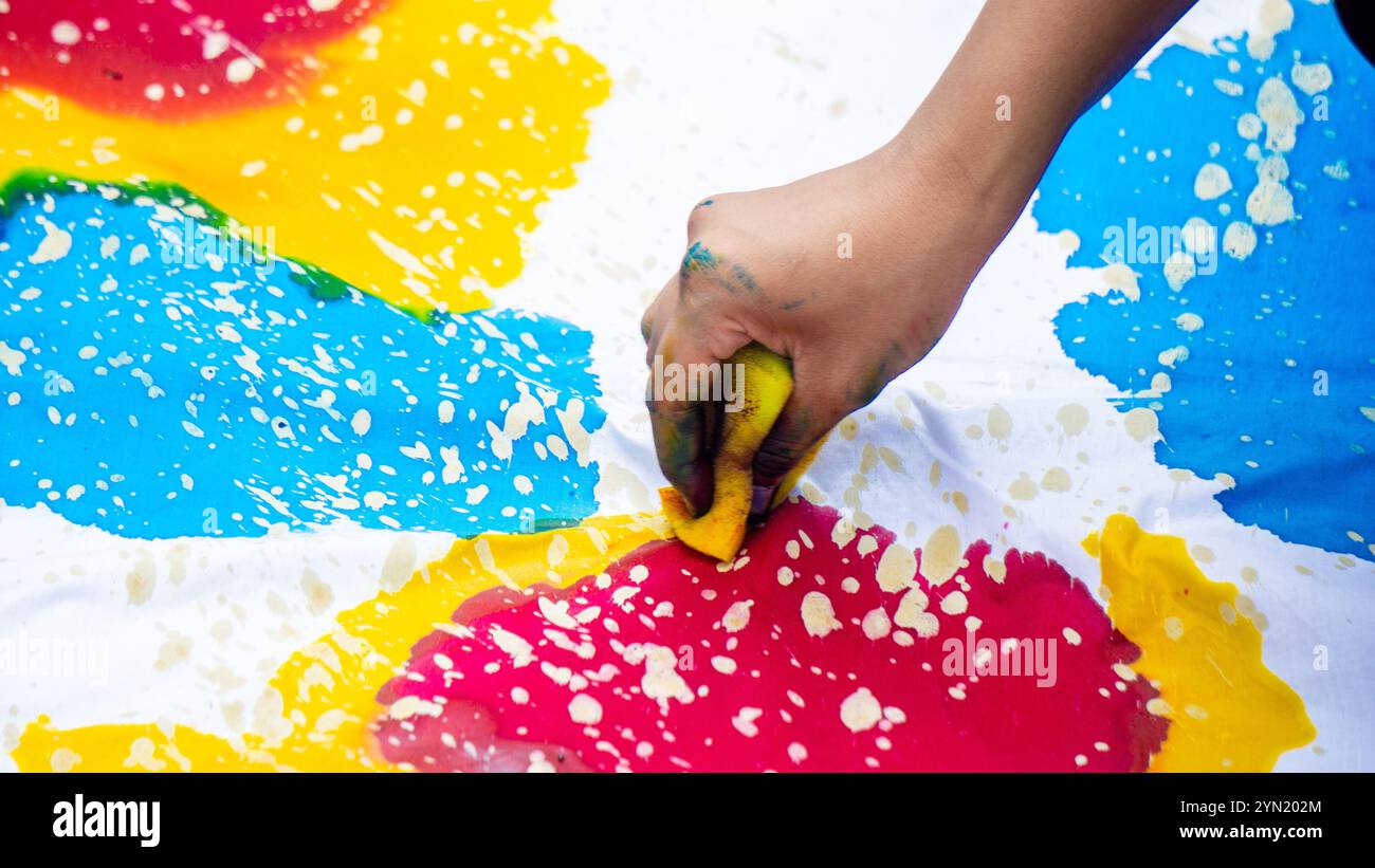 Making splash batik (batik ciprat). Batik is a type of cloth motif ...