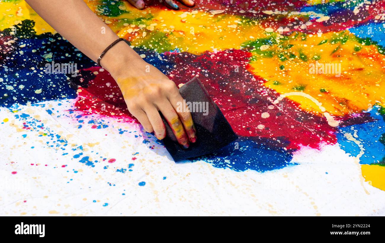 Making splash batik (batik ciprat). Batik is a type of cloth motif ...