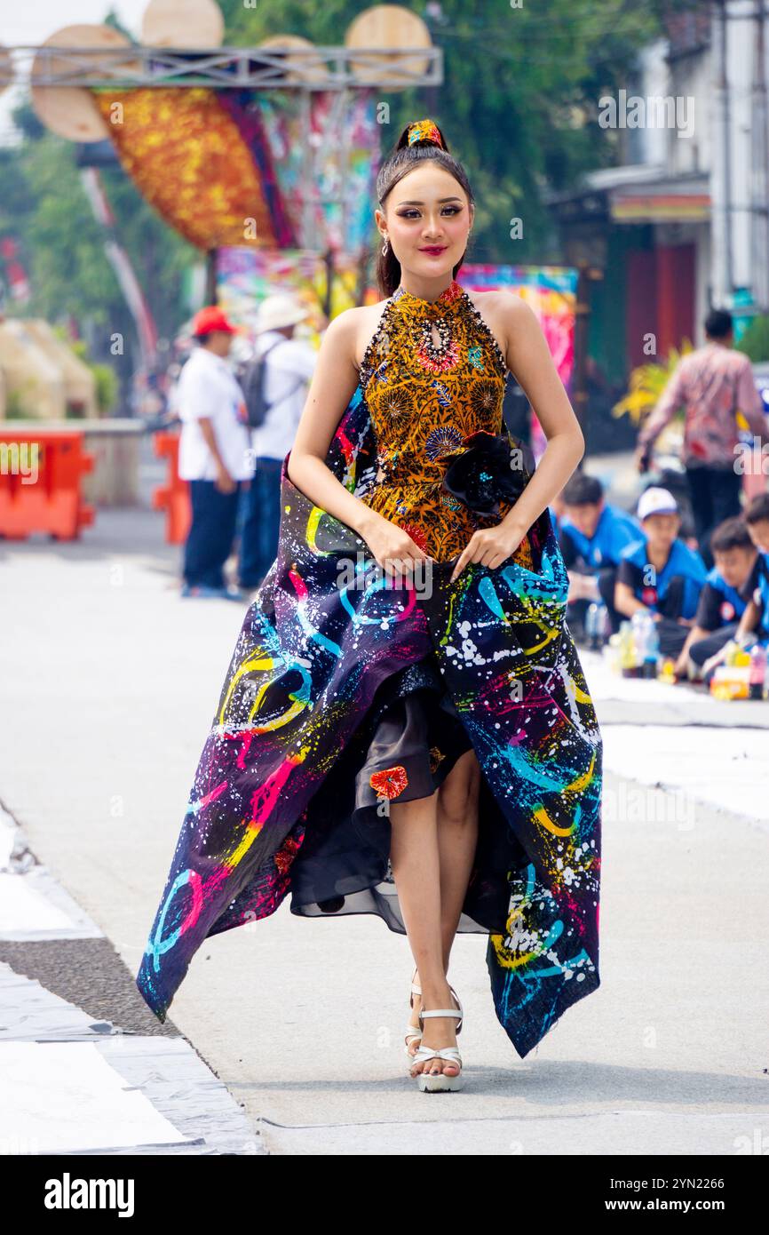 Woman with batik ciprat (Splash batik). Batik is a type of cloth motif ...