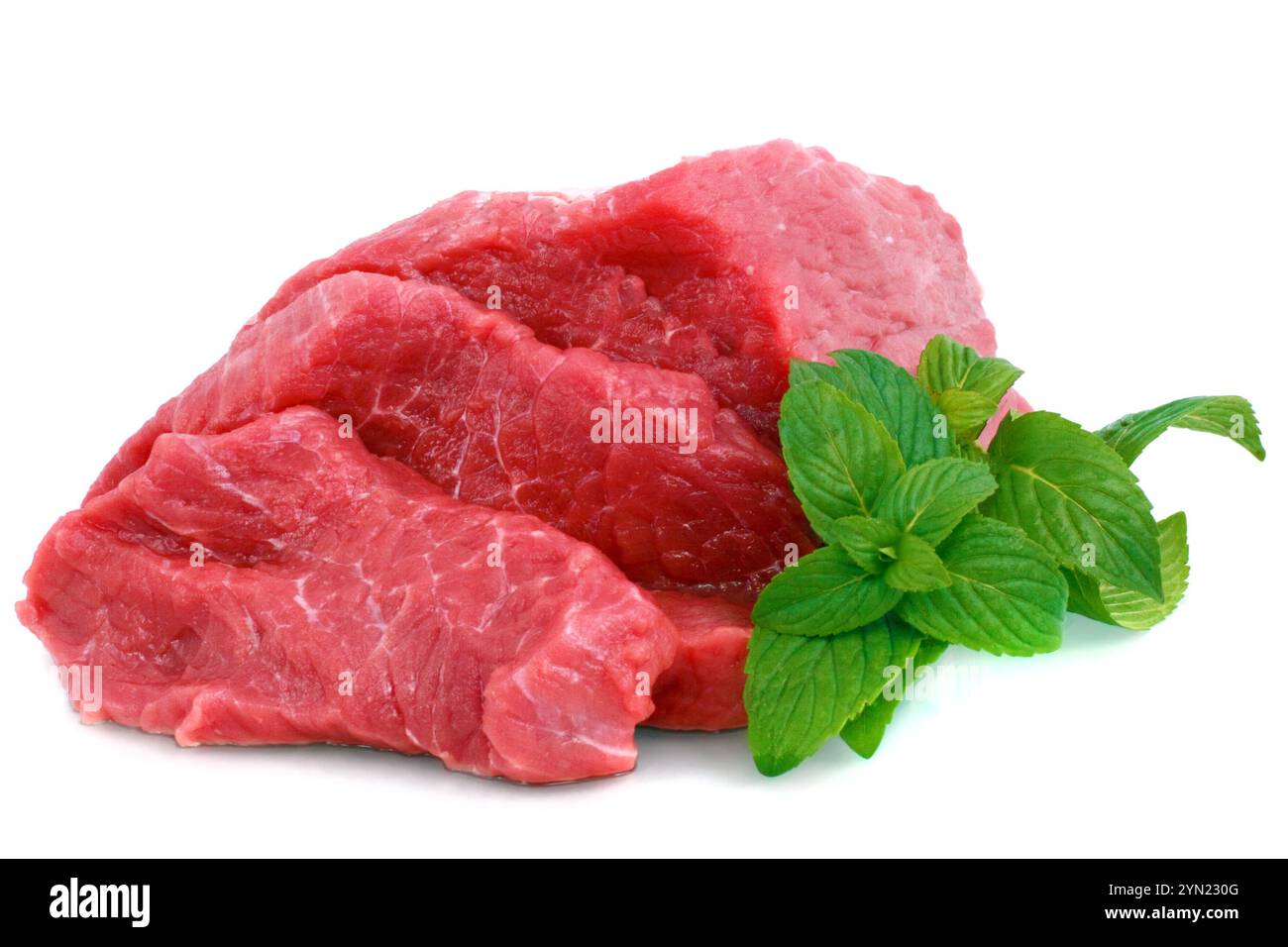 Cut of beef steak with green leaf. Isolated Stock Photo - Alamy