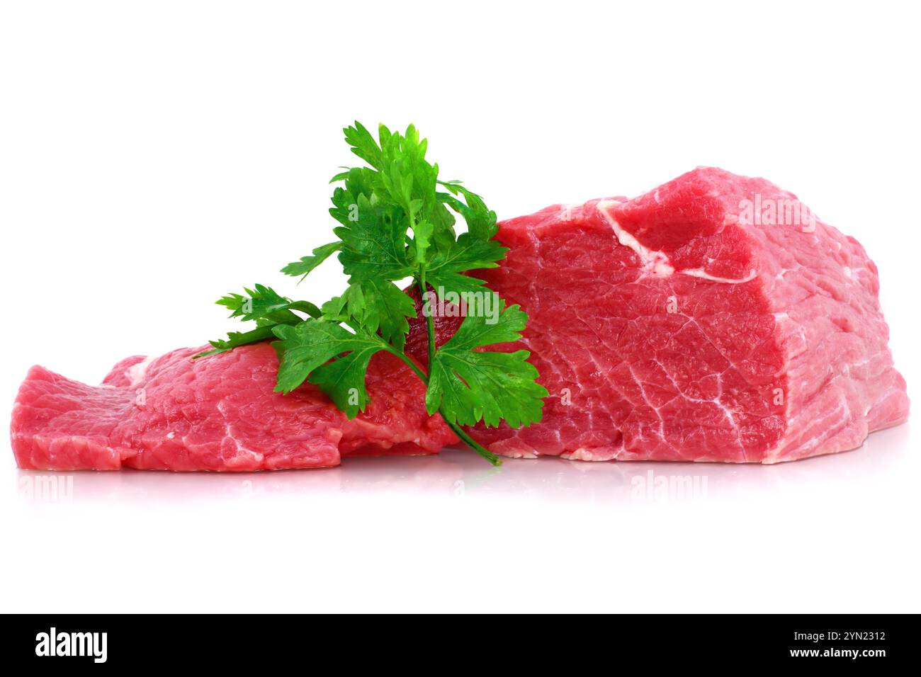 Cut of beef steak with green leaf. Isolated Stock Photo - Alamy