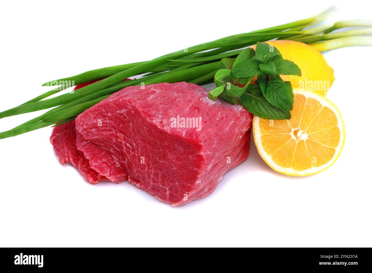 Cut of beef steak with lemon slice and onion. Isolated Stock Photo - Alamy