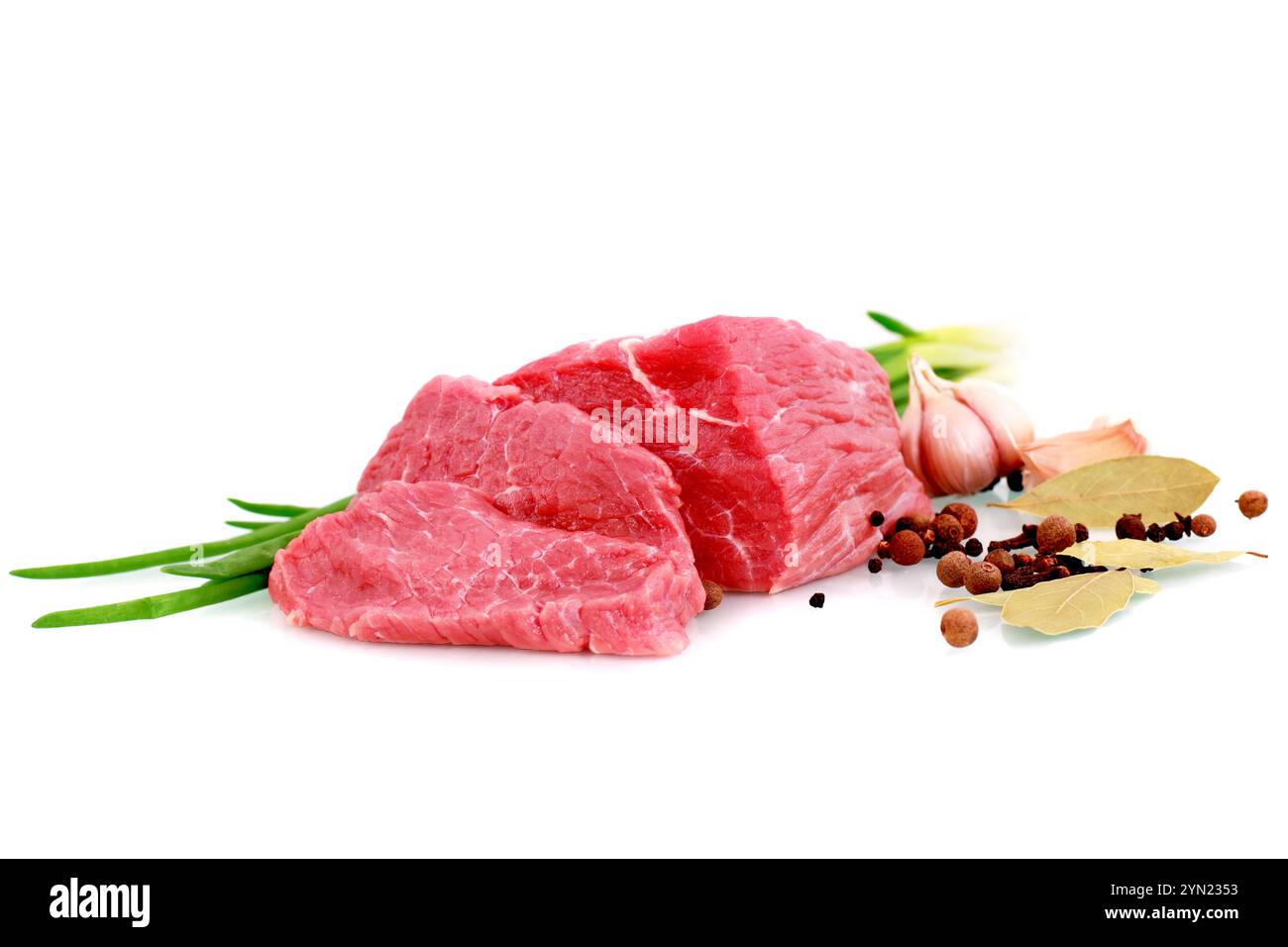 Cut of beef steak with garlic slice, onion and laurel. Isolated Stock ...