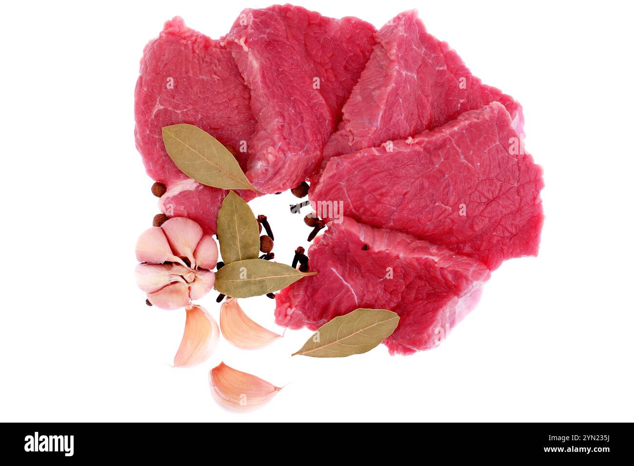 Cut of beef steak with garlic slice, onion and laurel. Isolated Stock ...