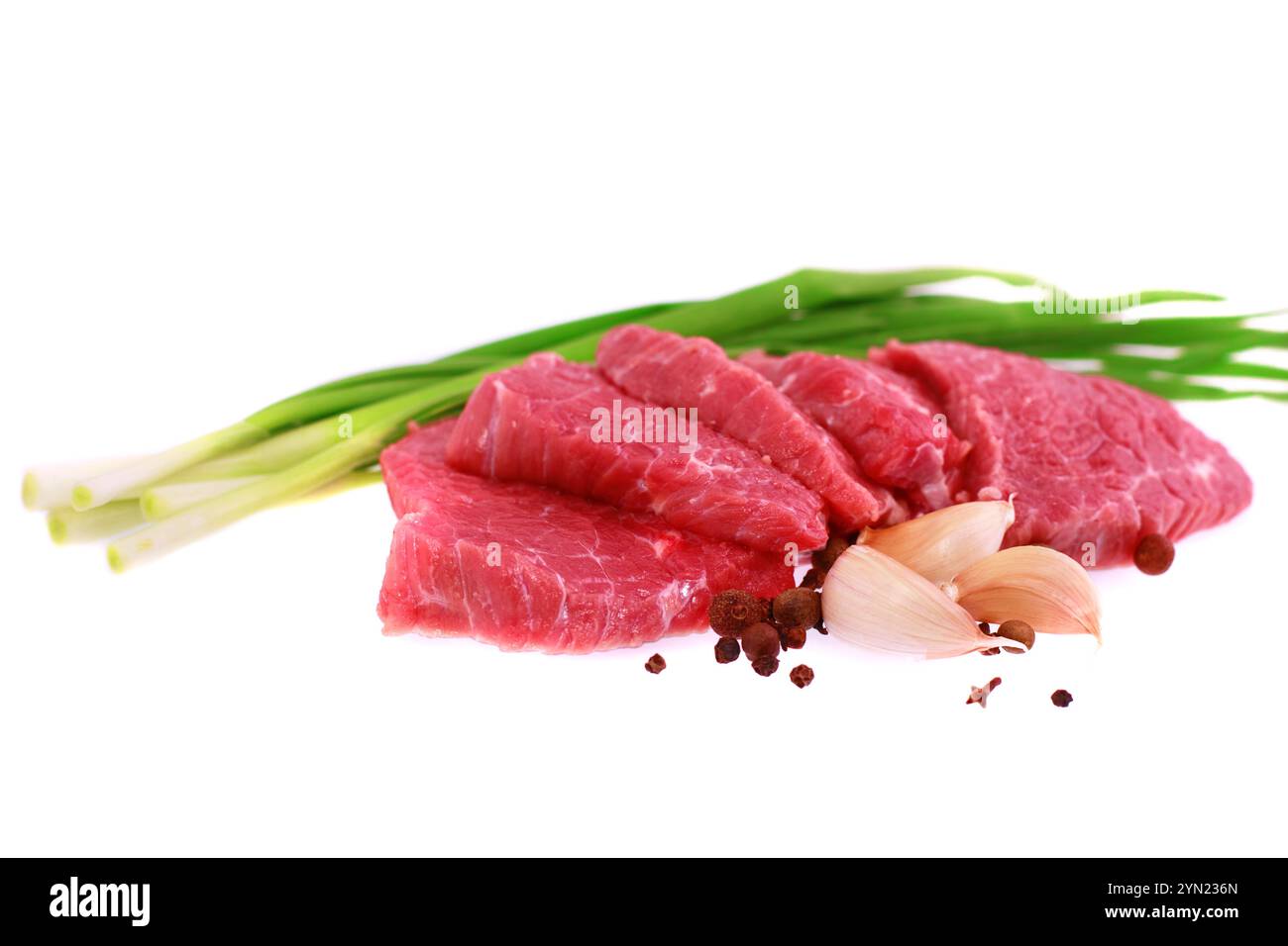 Cut of beef steak with garlic slice, onion and laurel. Isolated Stock ...