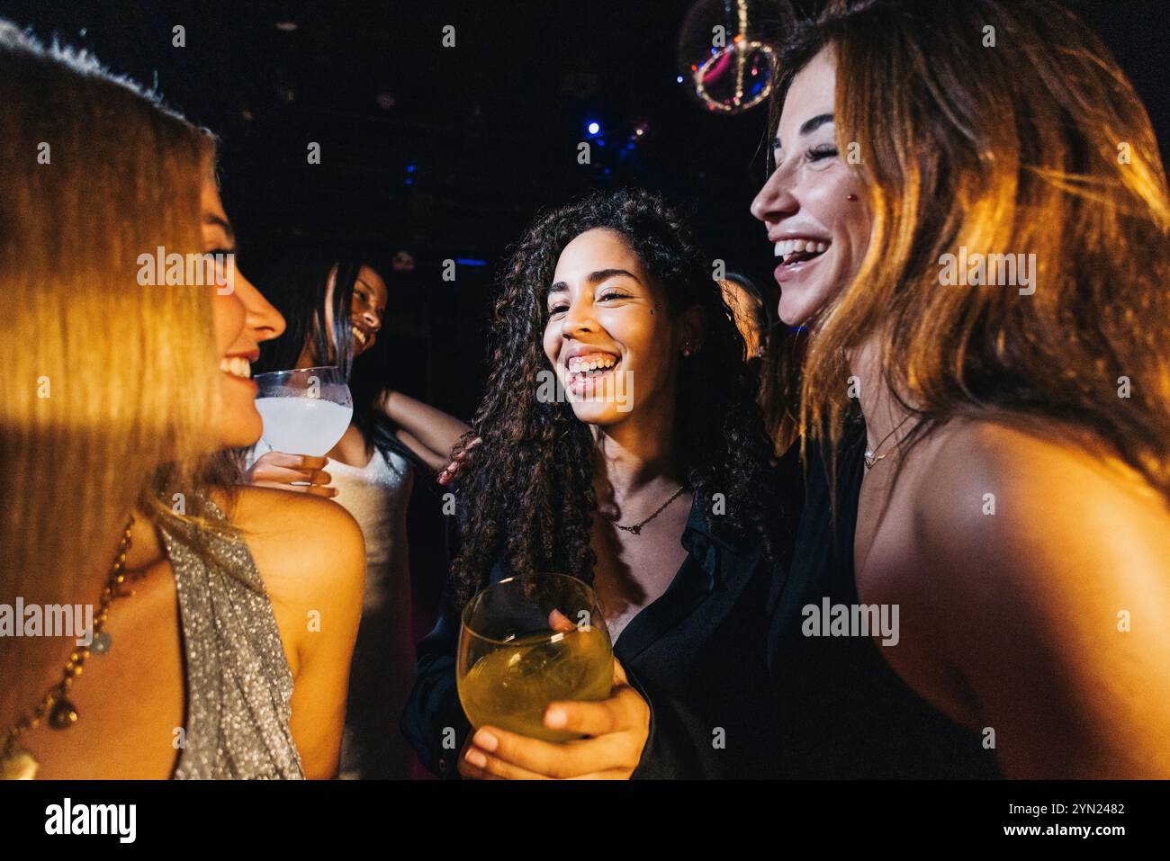 Energetic friends celebrating nightlife dancing hi-res stock ...