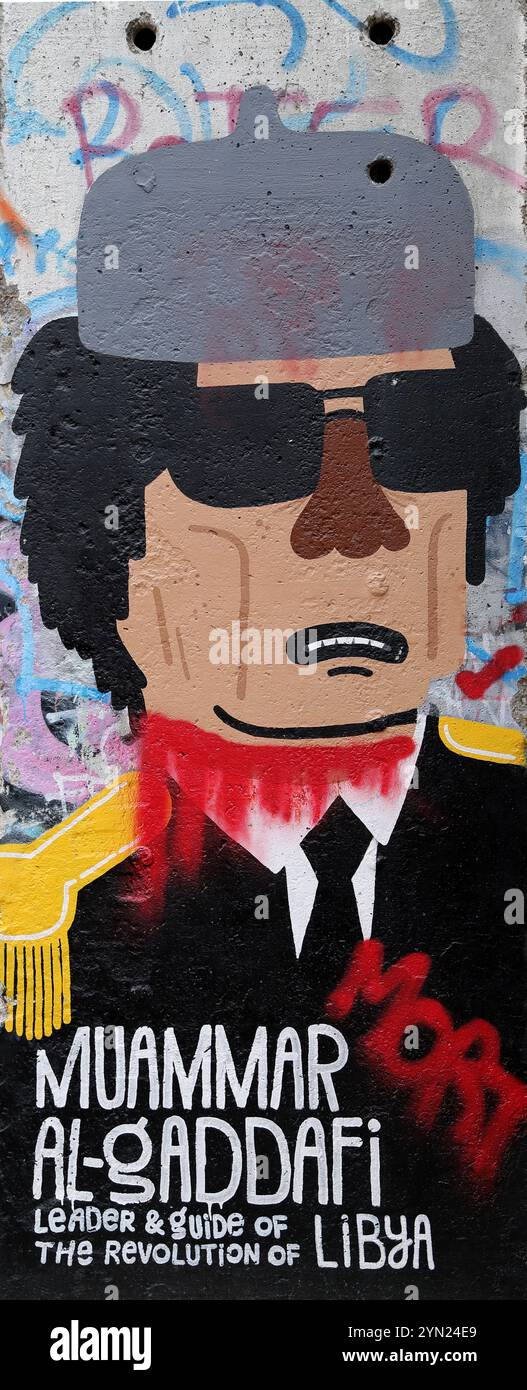 Berlin, Germany - July 10, 2013: Colorful portrayal of Muammar al ...