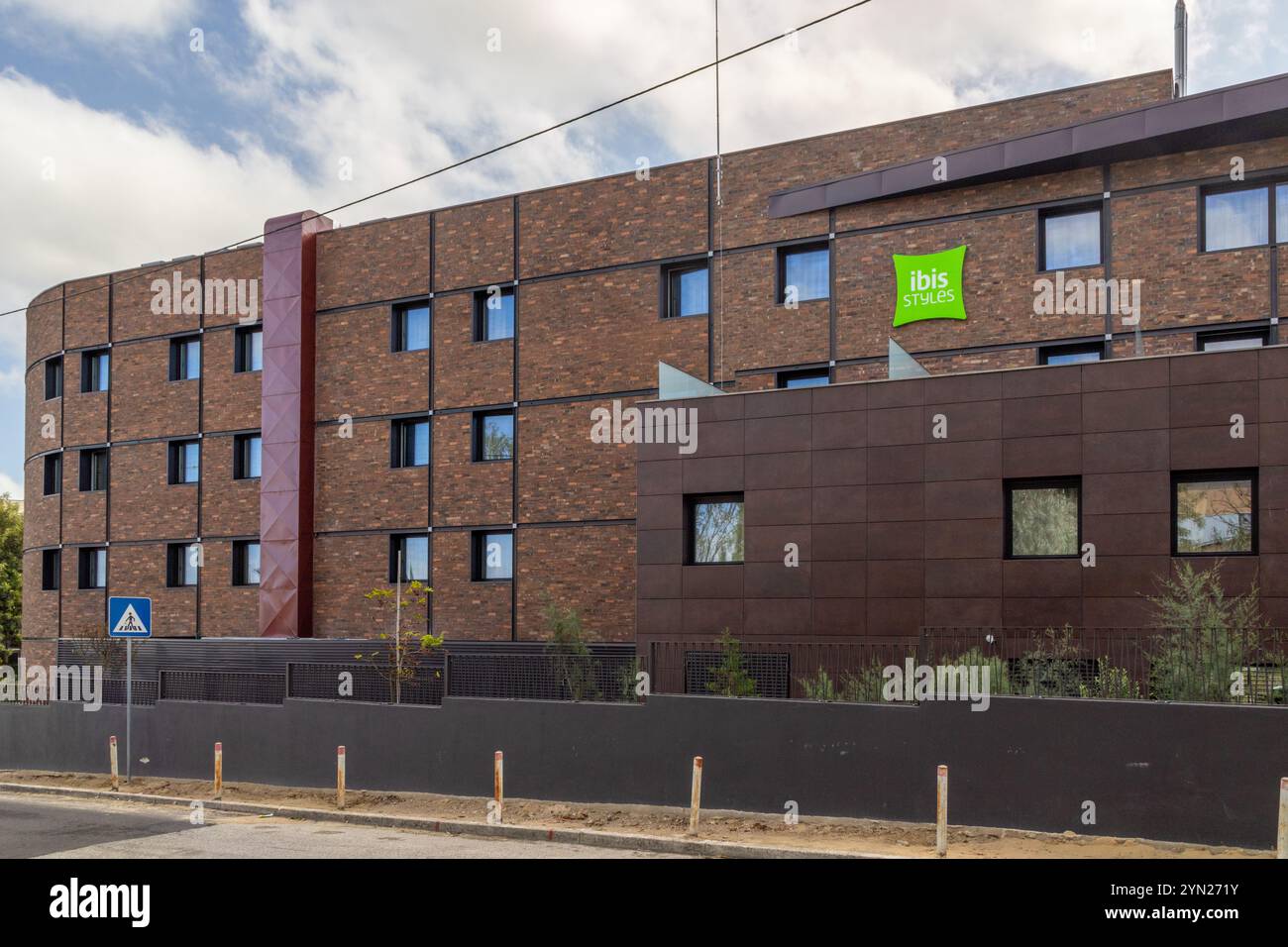 Modern architecture of hotel ibis styles in porto, portugal, featuring brick and metal facade ...