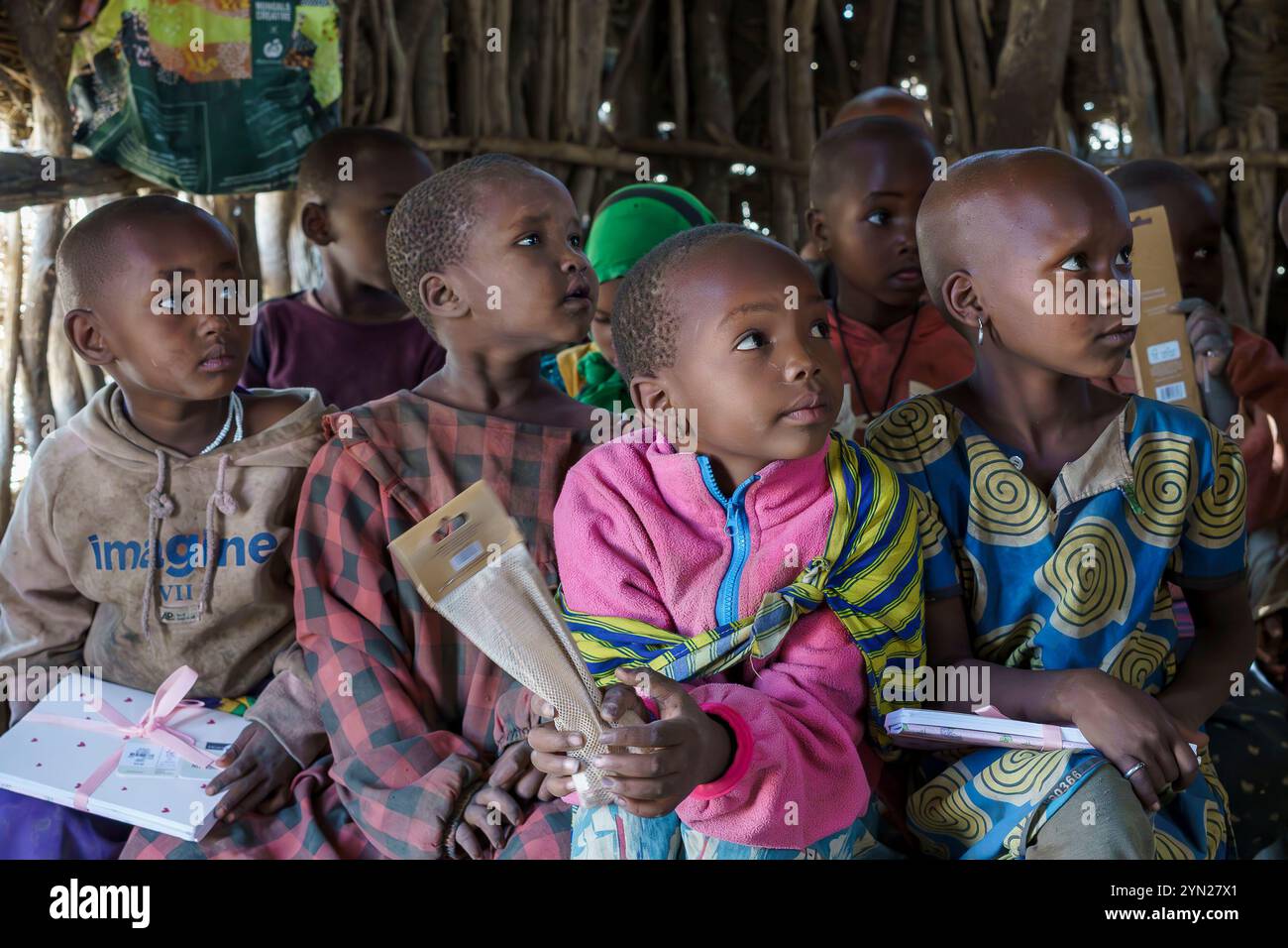 School children eagerly watching the teacher in a lesson at a massai ...