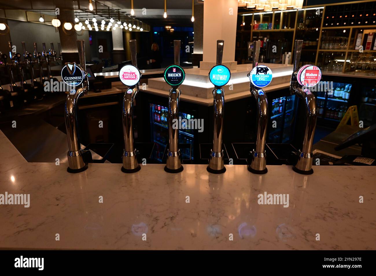 Beer taps at a deserted hotel bar Stock Photo - Alamy