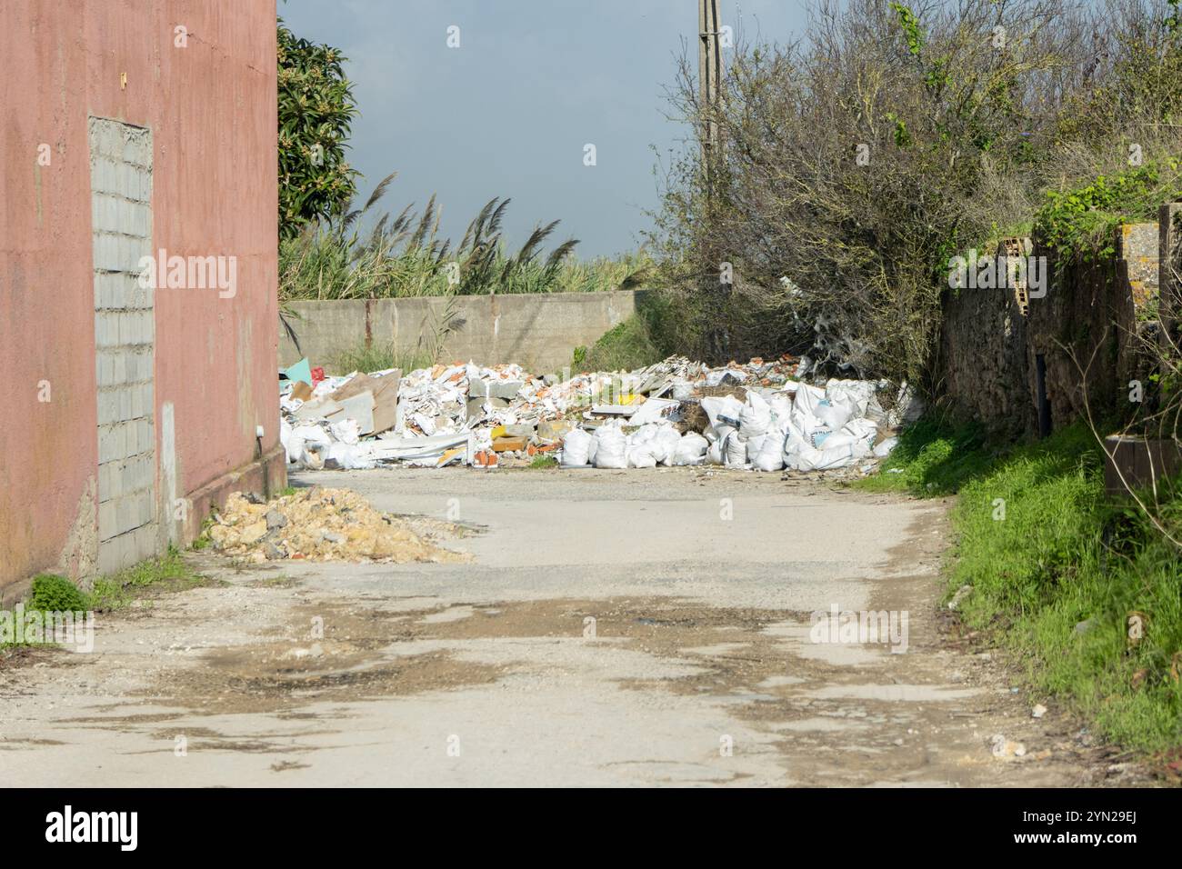 Construction debris and garbage polluting a street near an abandoned ...
