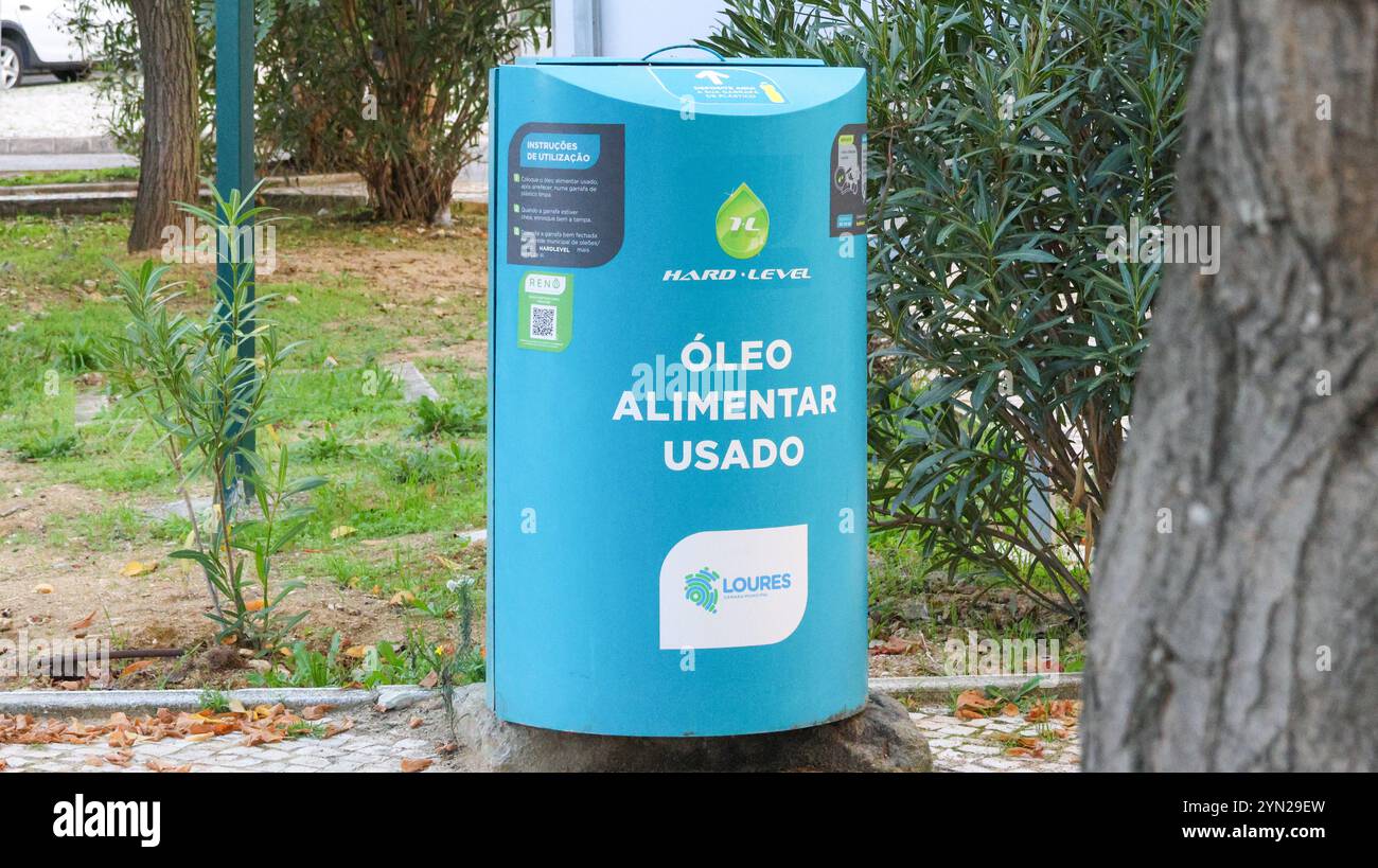 Blue container for collecting used cooking oil in a public park ...