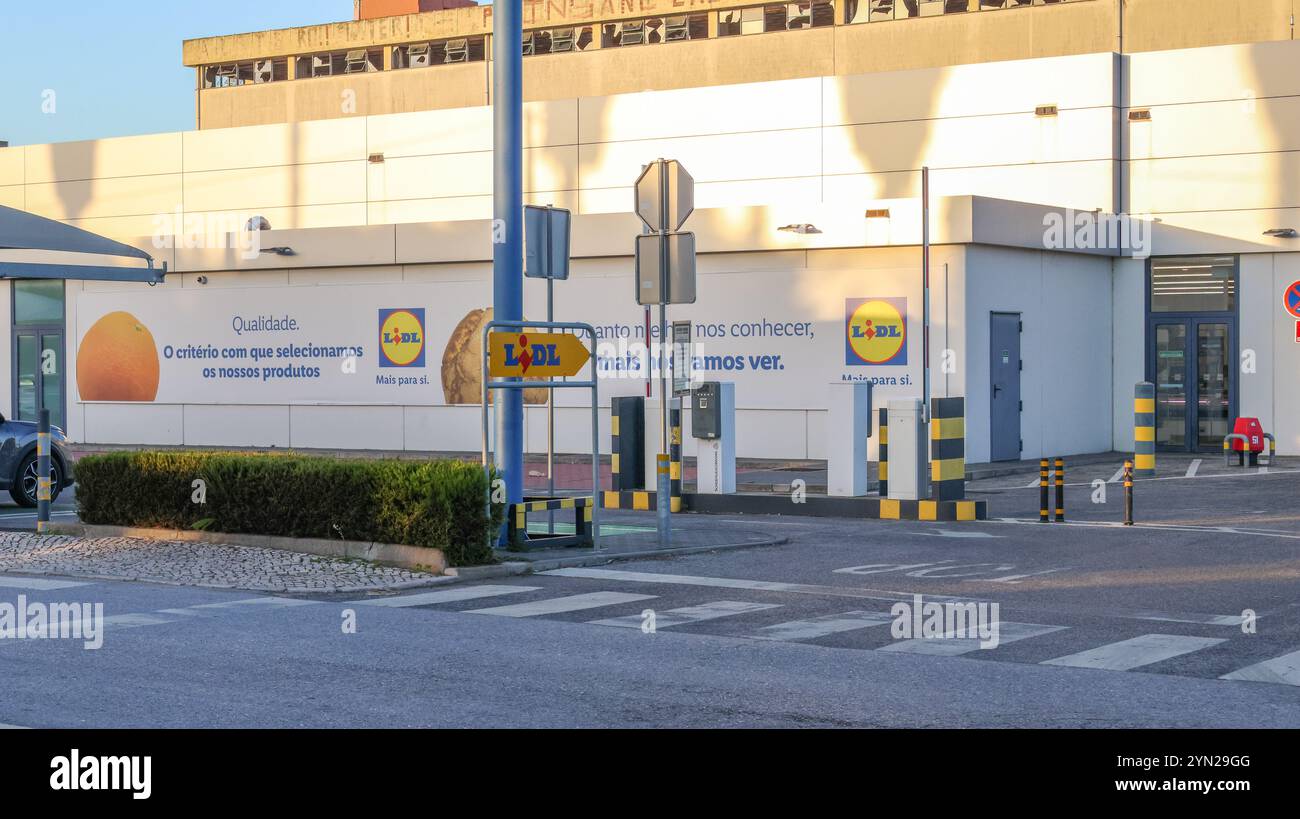 Lidl supermarket entrance showing signage, advertisements, and parking ...