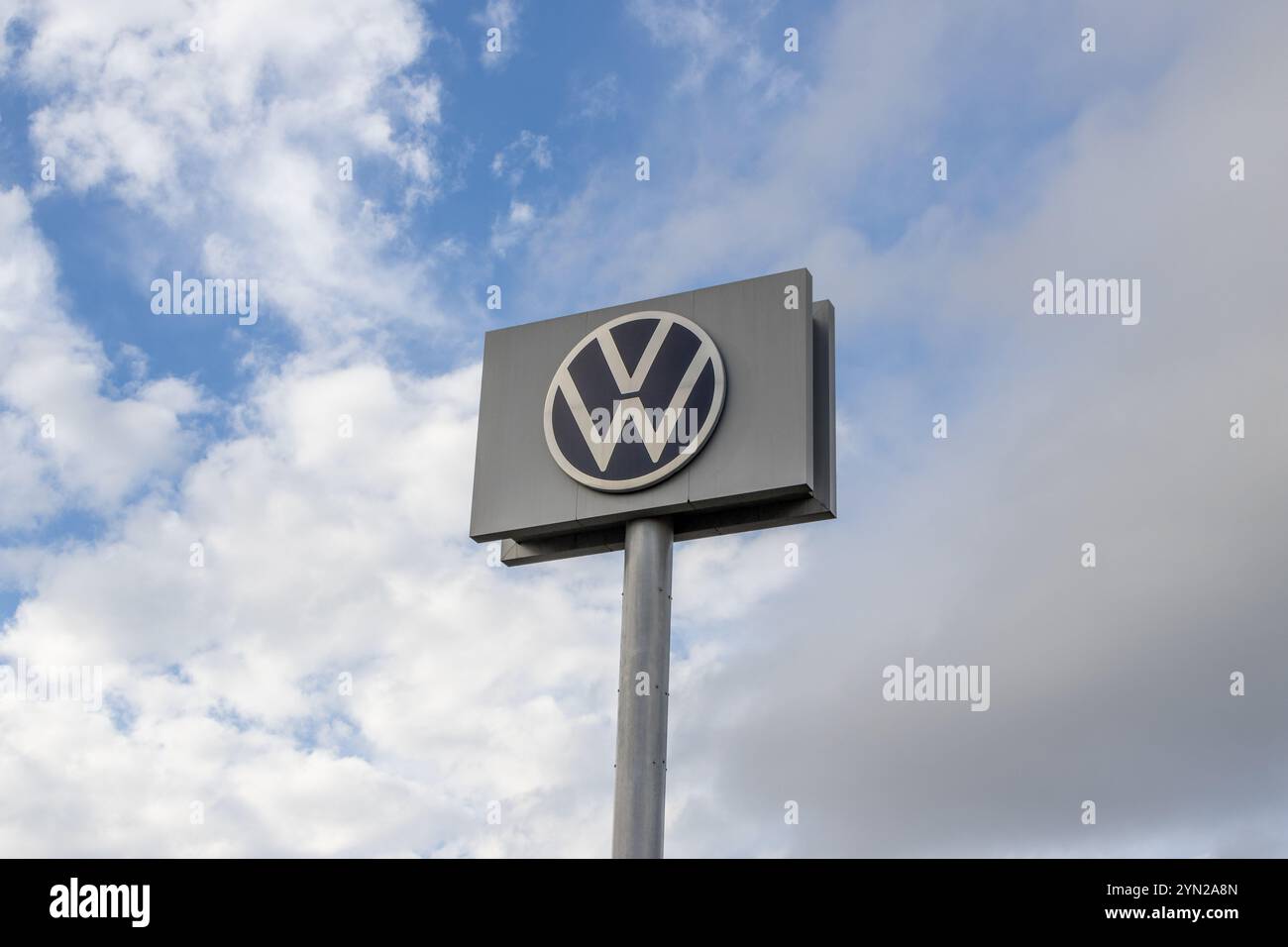 Volkswagen logo prominently displayed on a large sign against a ...