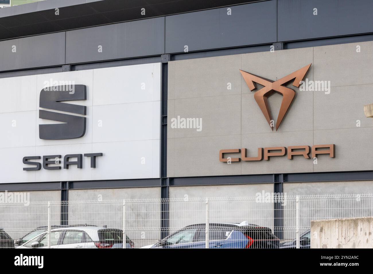 Seat and cupra logos displayed on modern car dealership building Stock ...