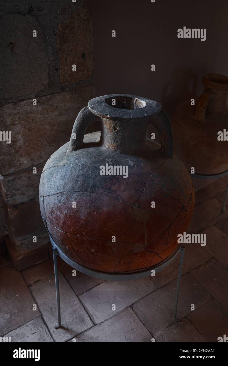 Broken clay pot isolated on a dark background. Ancient roman Clay ...
