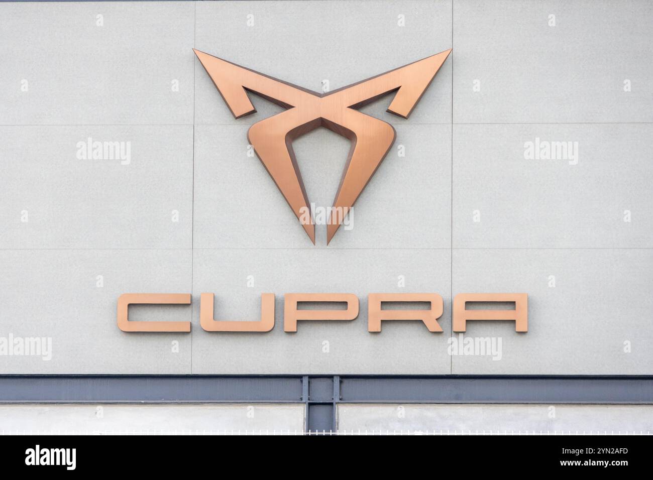 Cupra car manufacturer logo displayed on a modern building exterior ...