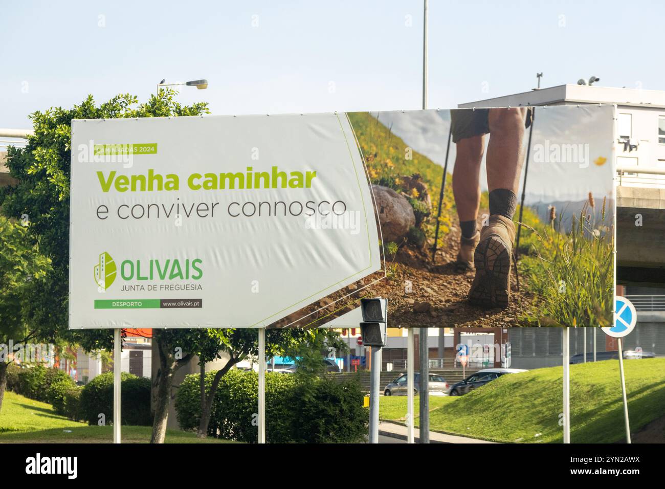 Large billboard promoting outdoor activities with close up of hiker's ...