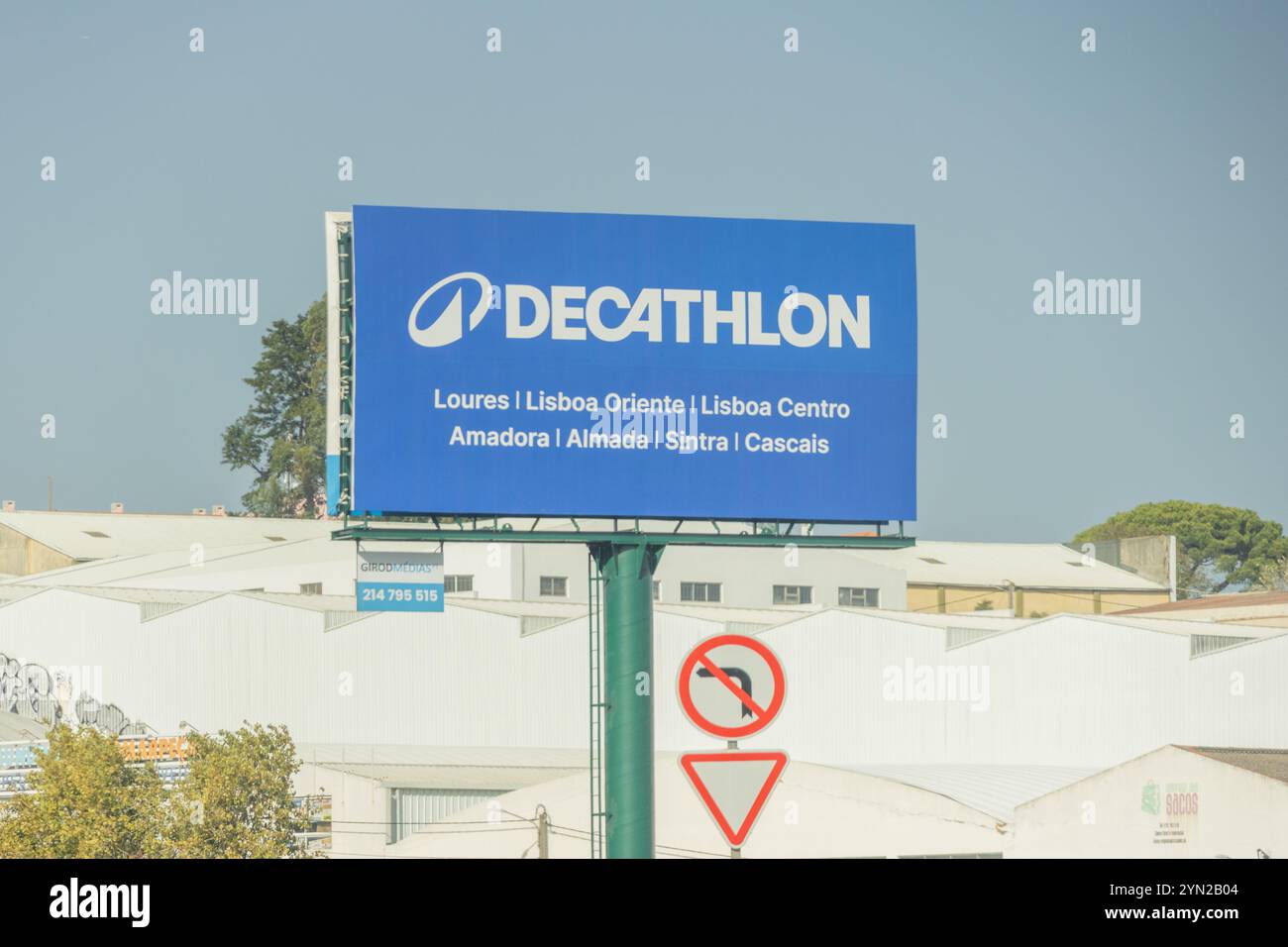 Large blue decathlon billboard displays store locations in loures ...