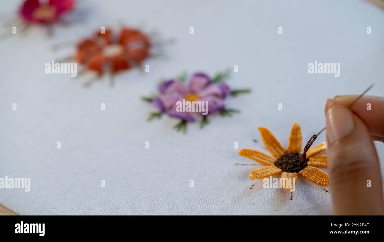Needle and Thread Magic: Creating Flowers with Colorful Threads Stock ...