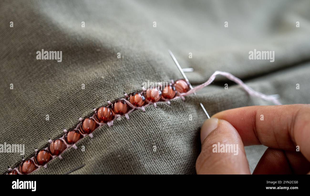 Stitch by Stitch: A Woman's Hand Creates with Needle and Thread Stock ...