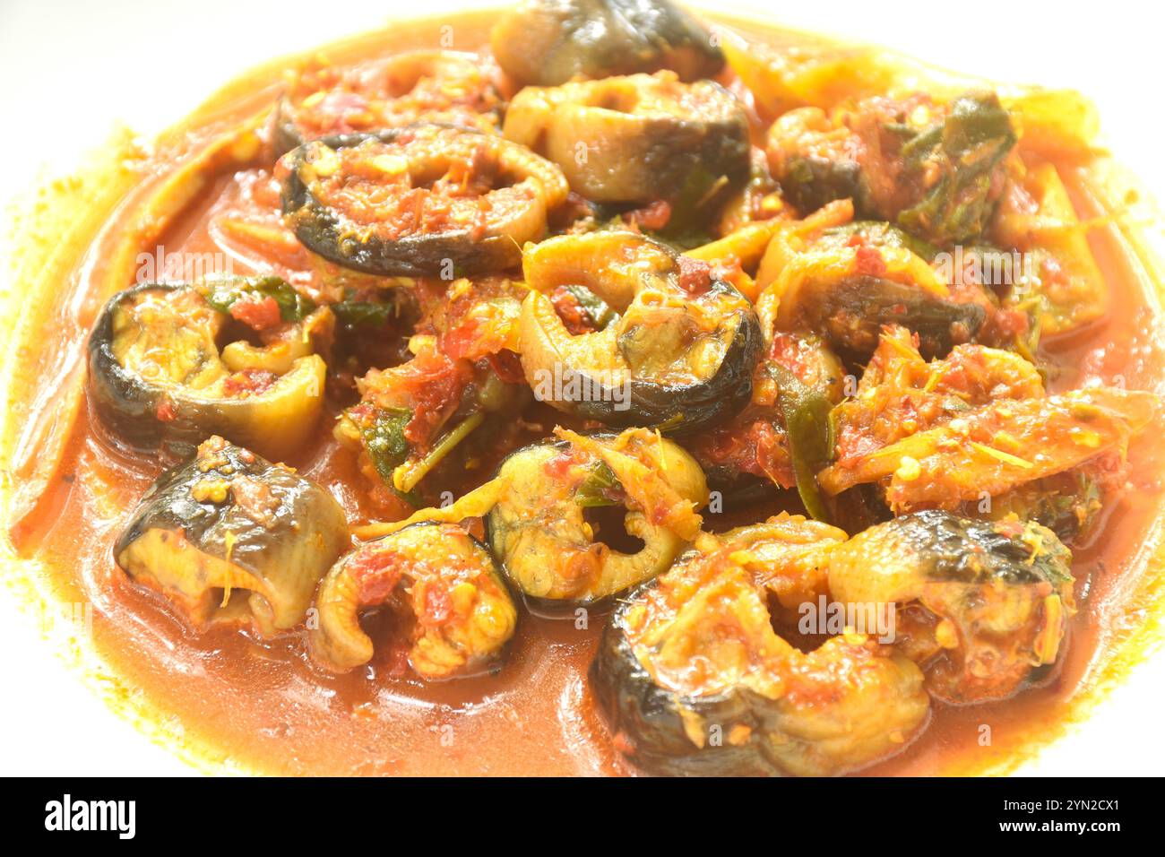 spicy fried slice eel fresh water fish with curry and herb on plate ...