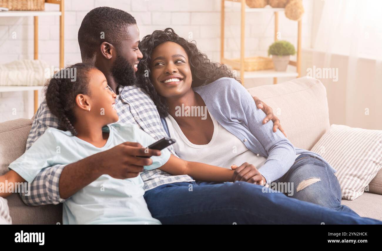 Cheerful Black Family Having Fun Together Watching TV Show Stock Photo ...