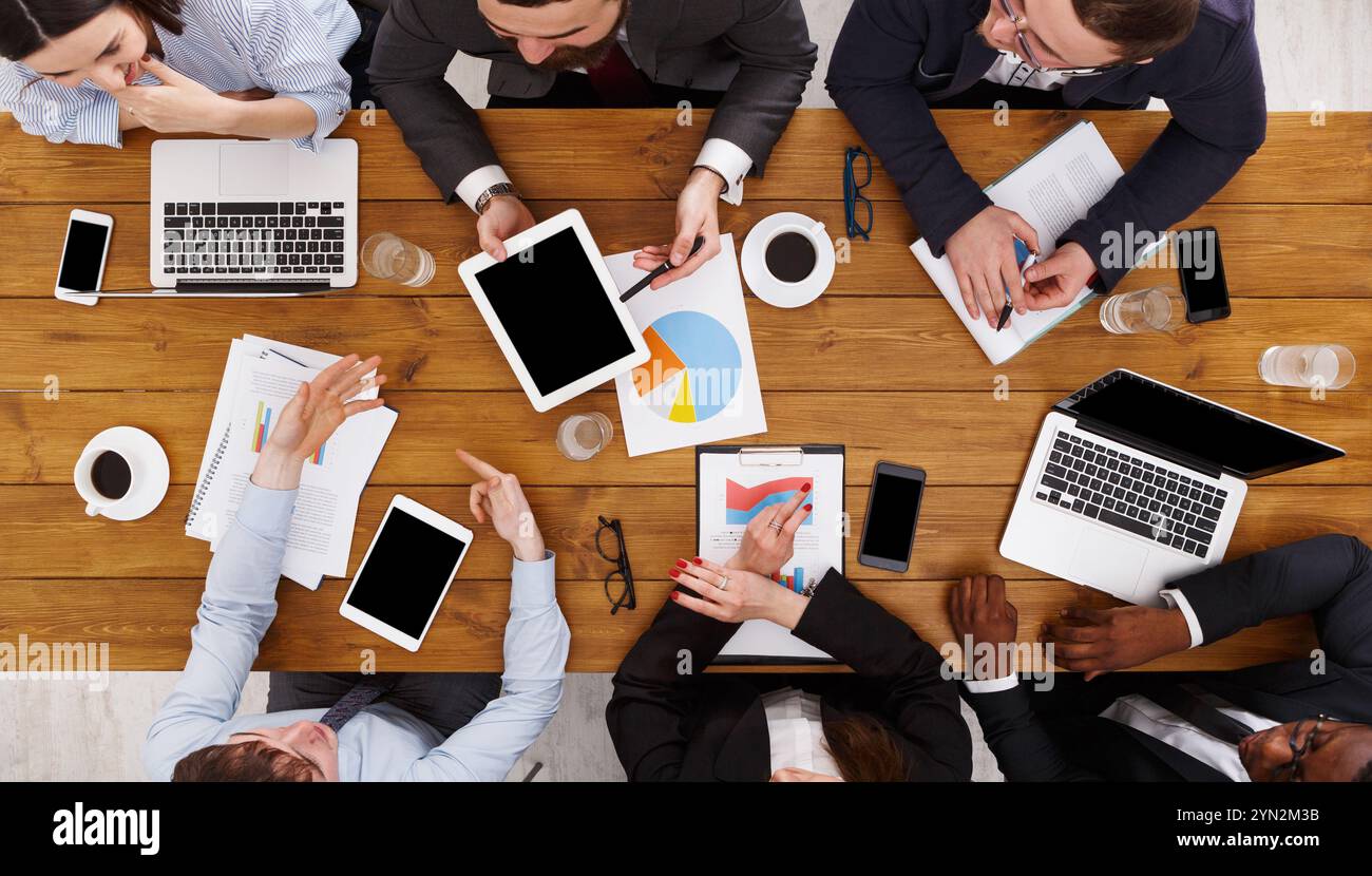 Group of busy business people meeting in office, top view Stock Photo ...
