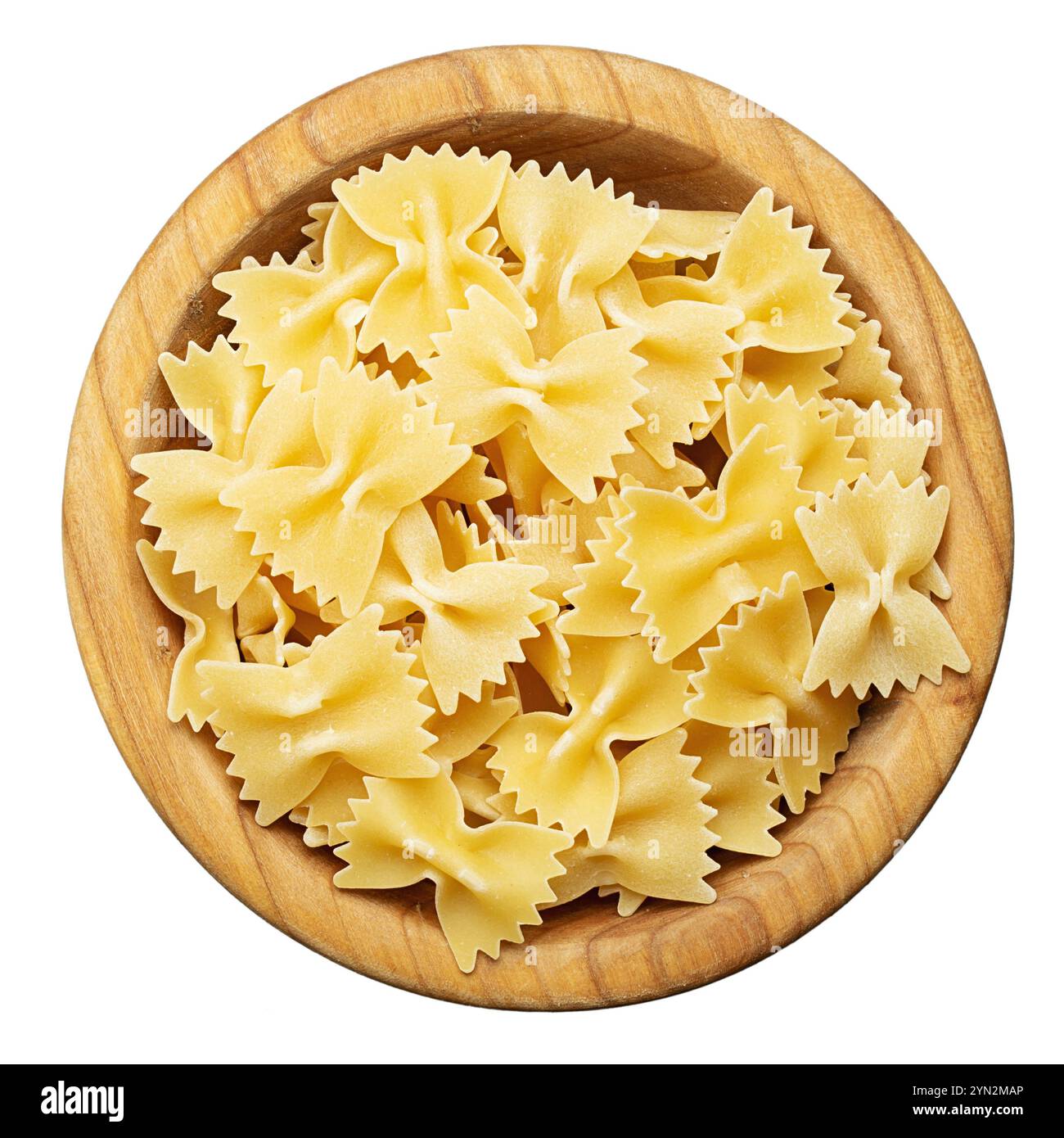 Raw farfalle pasta in a bowl isolated on white background. File ...