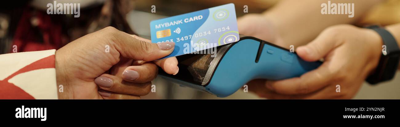 Handing Credit Card for Payment Using Card Reader Stock Photo - Alamy