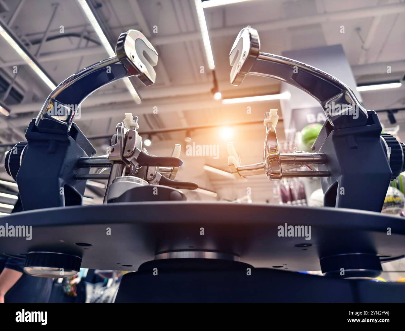 Strings a badminton racket on a racket stringing machine Stock Photo ...