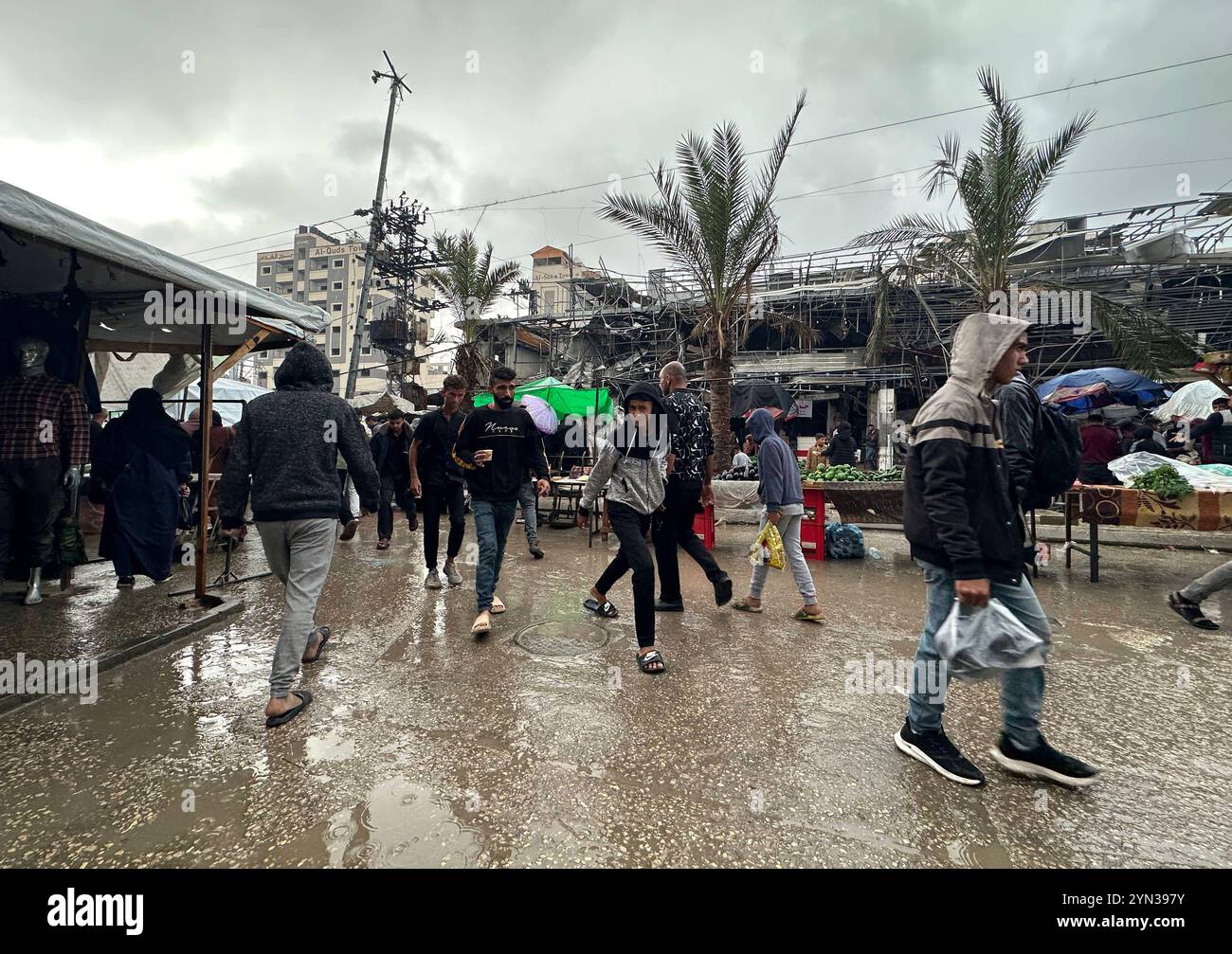 Palestinians, navigating winter conditions in clothing and slippers ill ...