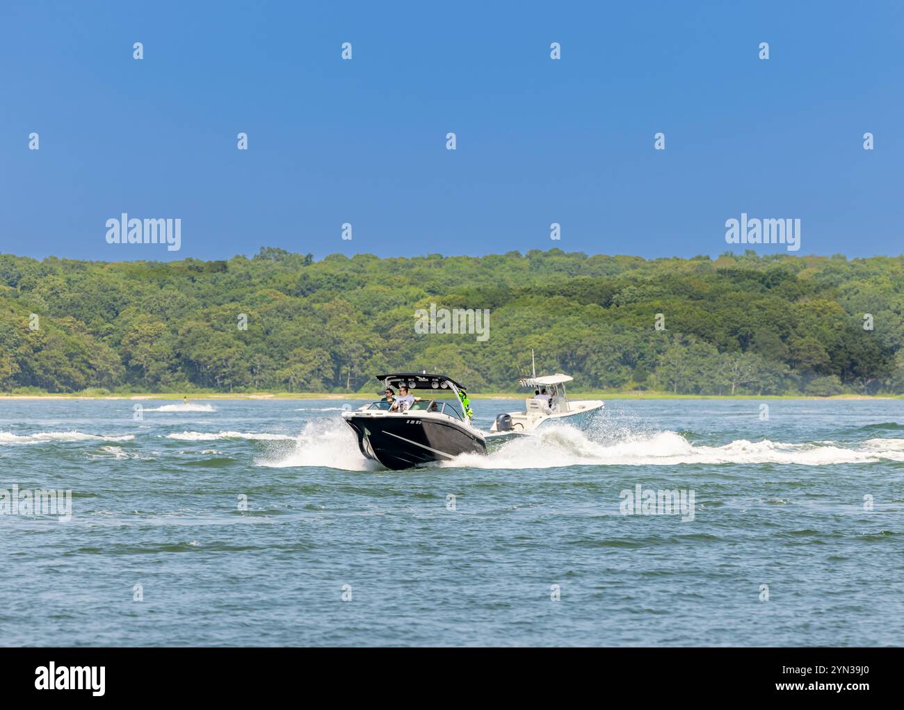boats passing on a summer day off tyndal point Stock Photo - Alamy