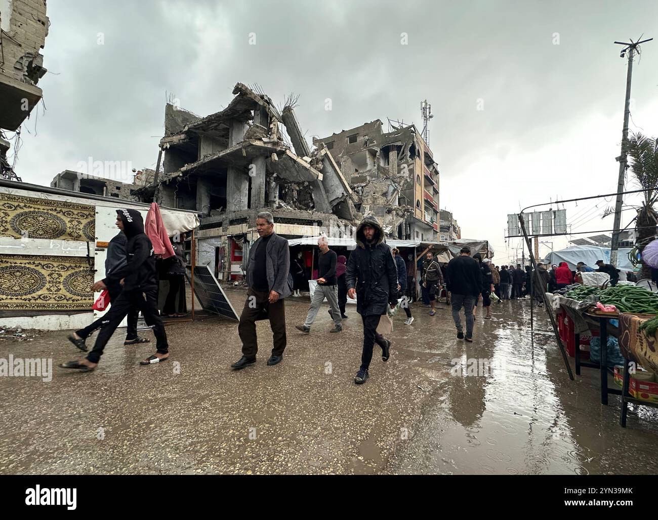 Palestinians, navigating winter conditions in clothing and slippers ill ...