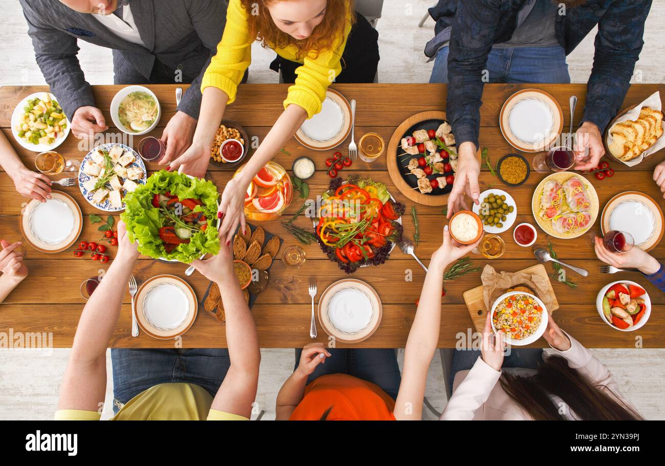 People eat healthy meals at served table dinner party Stock Photo - Alamy