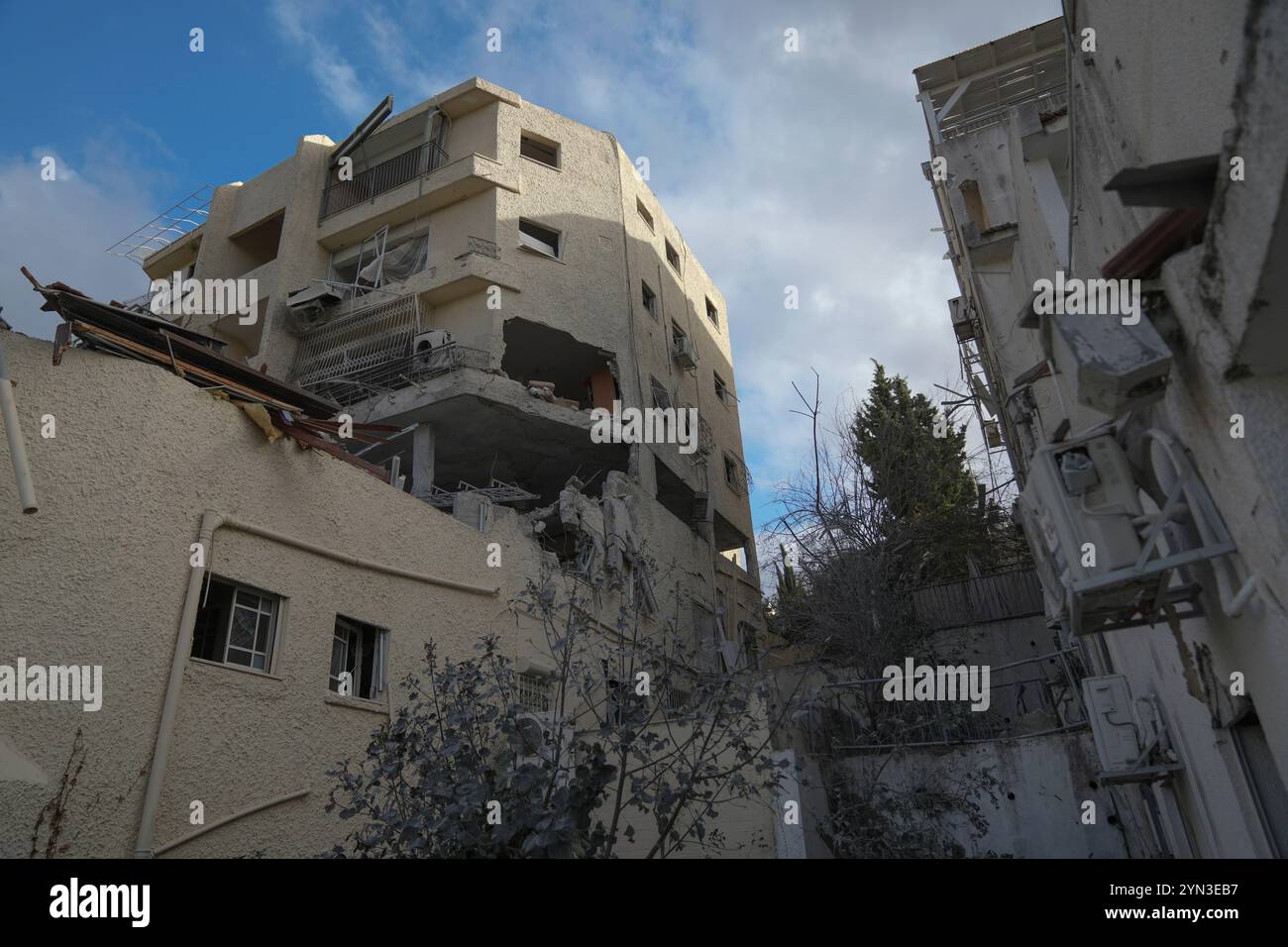 The damage caused by a rocket fired from Lebanon is seen in a building ...